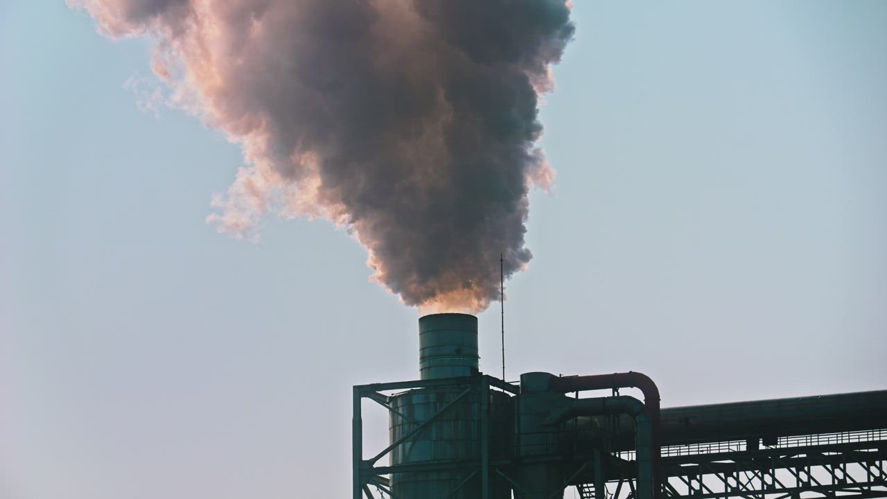 Thick, smoke emissions from a factory chimney - Free Stock Video