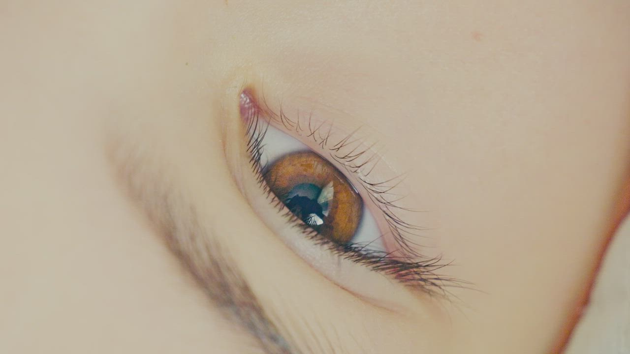 Close up of a woman opening her eye - Free Stock Video