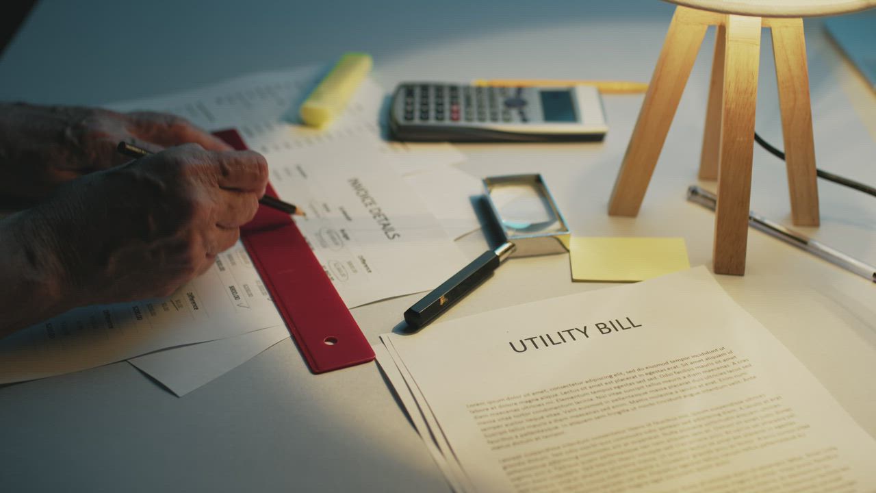 Man at home accounts for payments to be made - Free Stock Video