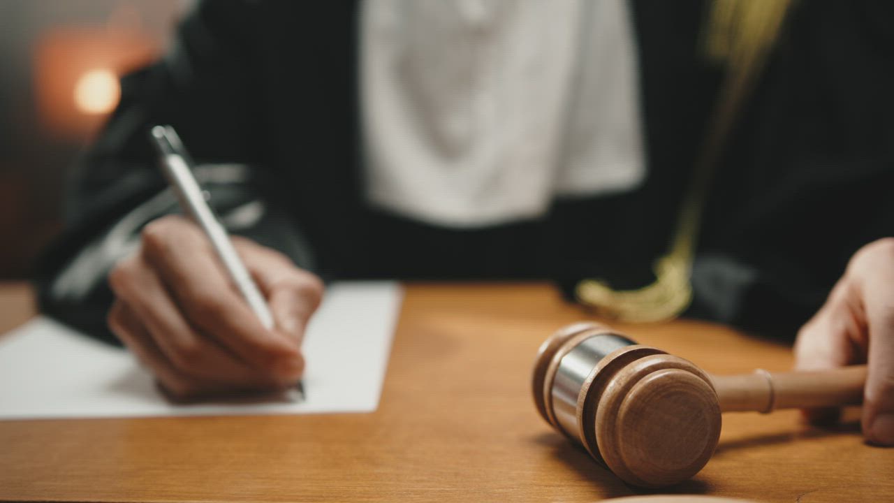 Judge writes verdict and sentence to be imposed - Free Stock Video