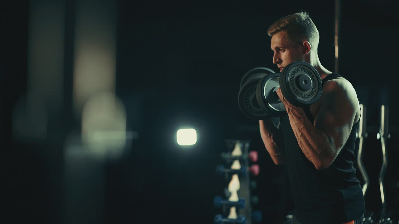 Muscular guy training at the gym - Free Stock Video