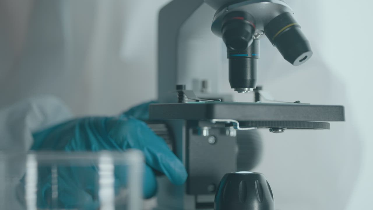 Scientist working with the microscope - Free Stock Video