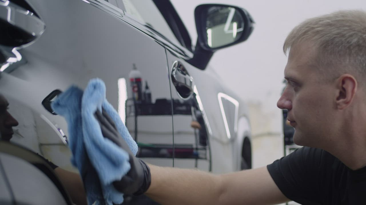 Close up of a man polishing a newly polished car - Free Stock Video