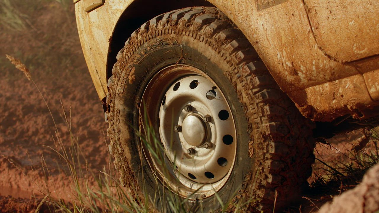 Close up of a four-wheel drive going off road through the mud - Free ...