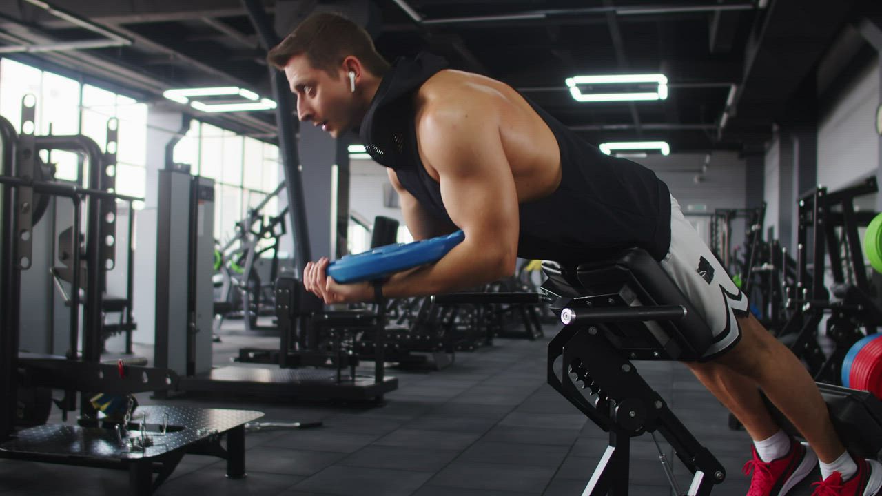 Man lifting a heavyweight at the gym - Free Stock Video