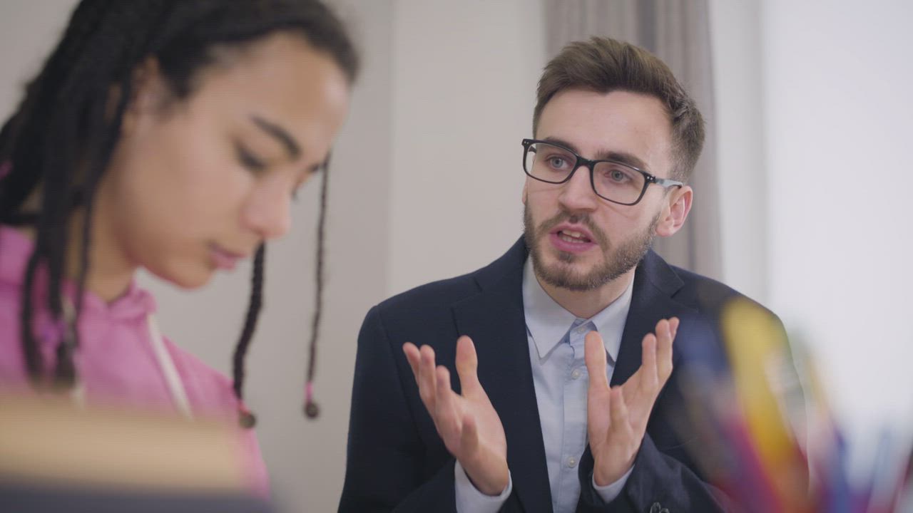 Strict teacher scolds his student - Free Stock Video