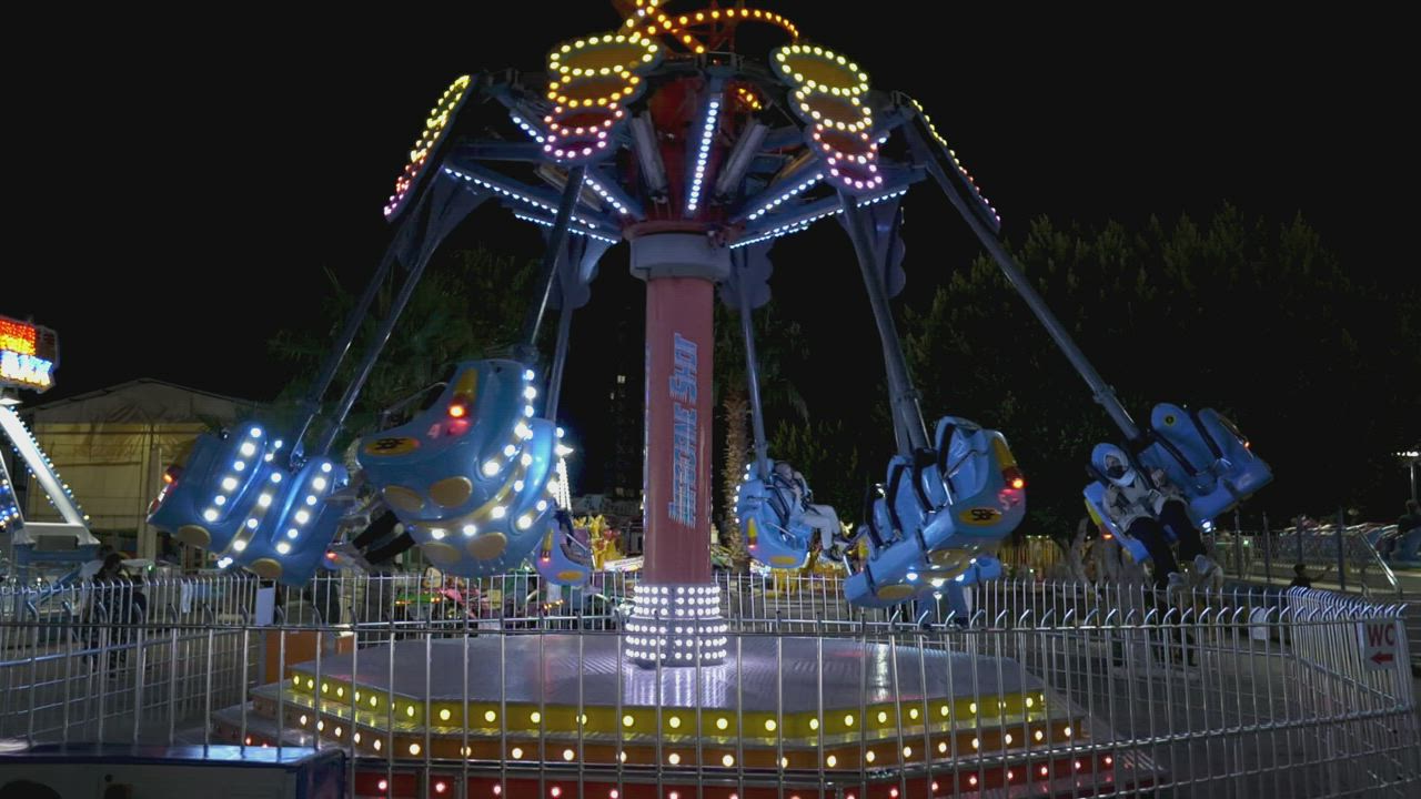 Entertaining carousel game at fair - Free Stock Video