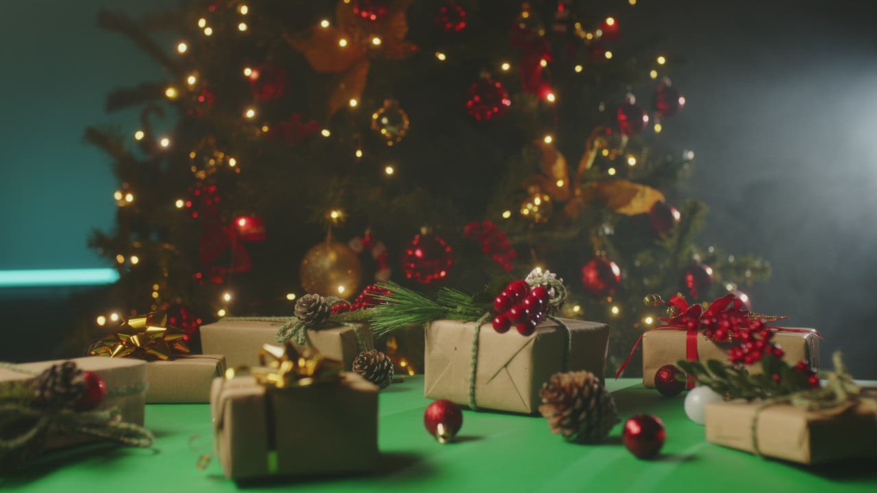 Table full of gifts and a Christmas tree in the background - Free Stock ...