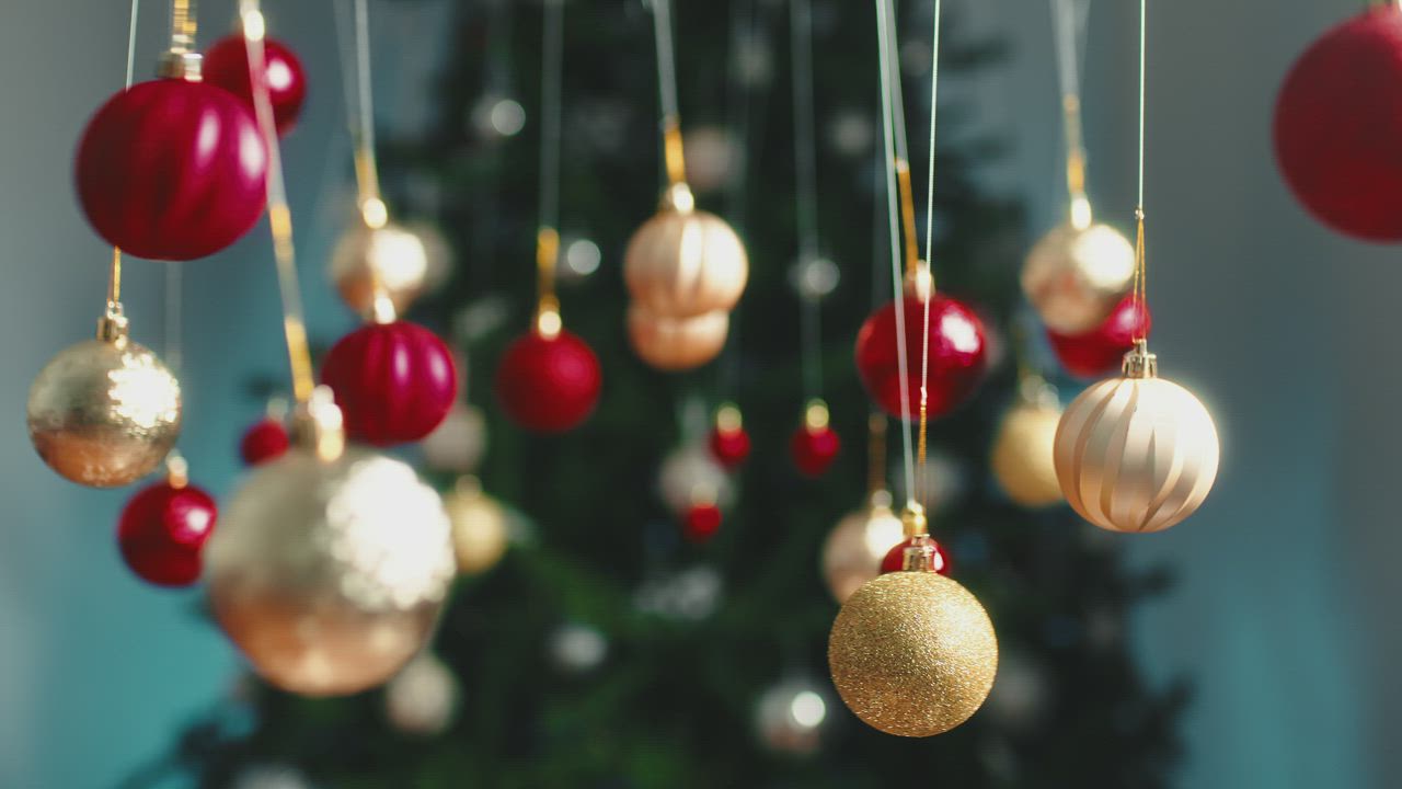 Many Christmas balls moving in front of the Christmas tree - Free Stock ...