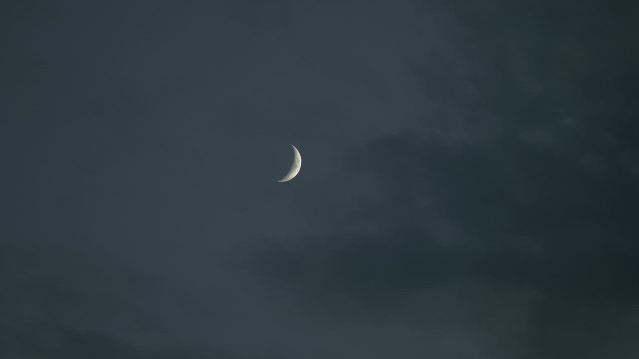Cloudy moon during an eclipse - Free Stock Video
