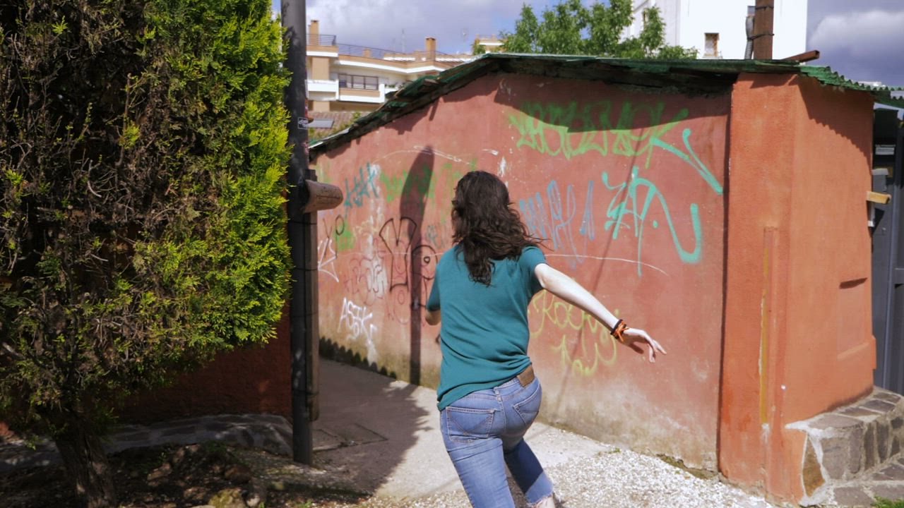 Scared young woman running away from danger - Free Stock Video