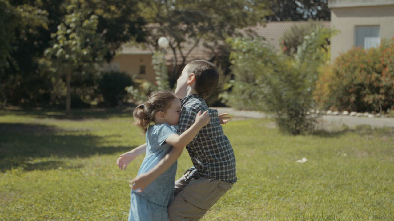 Big brother comforts little sister - Free Stock Video