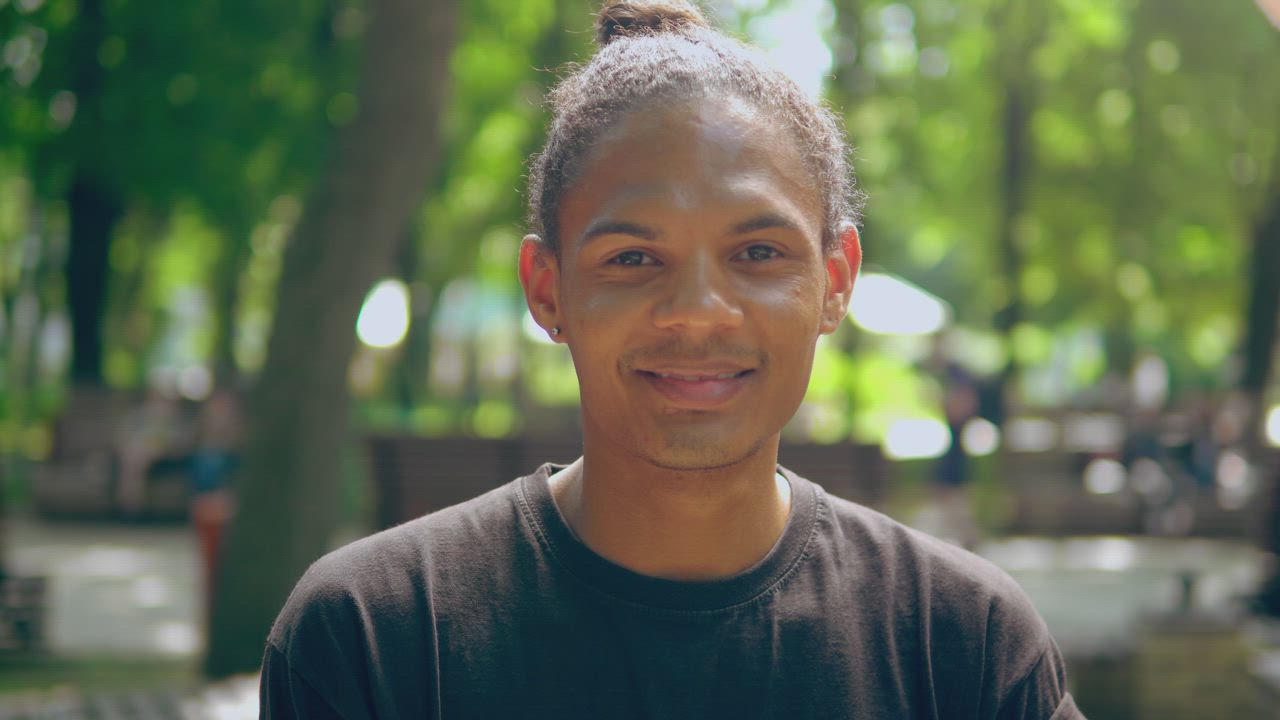 Man smiling in a park - Free Stock Video