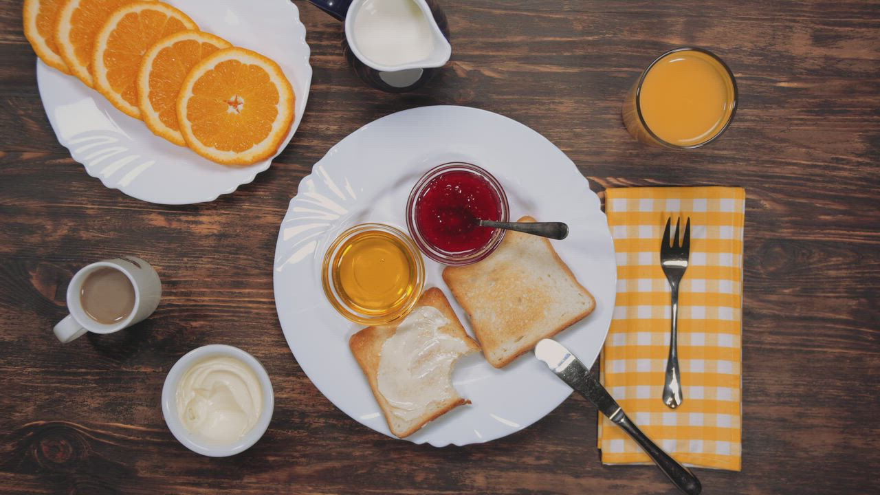 Woman preparing toast for breakfast - Free Stock Video