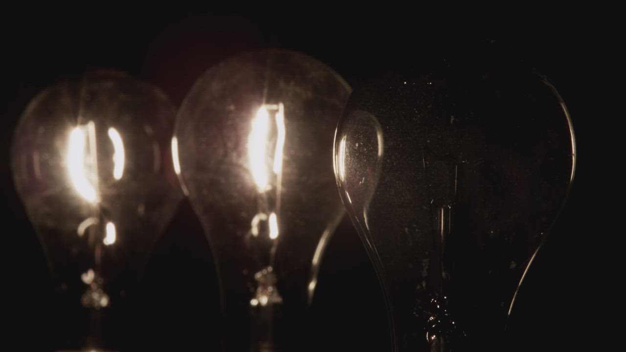 Three light bulbs illuminate - Free Stock Video