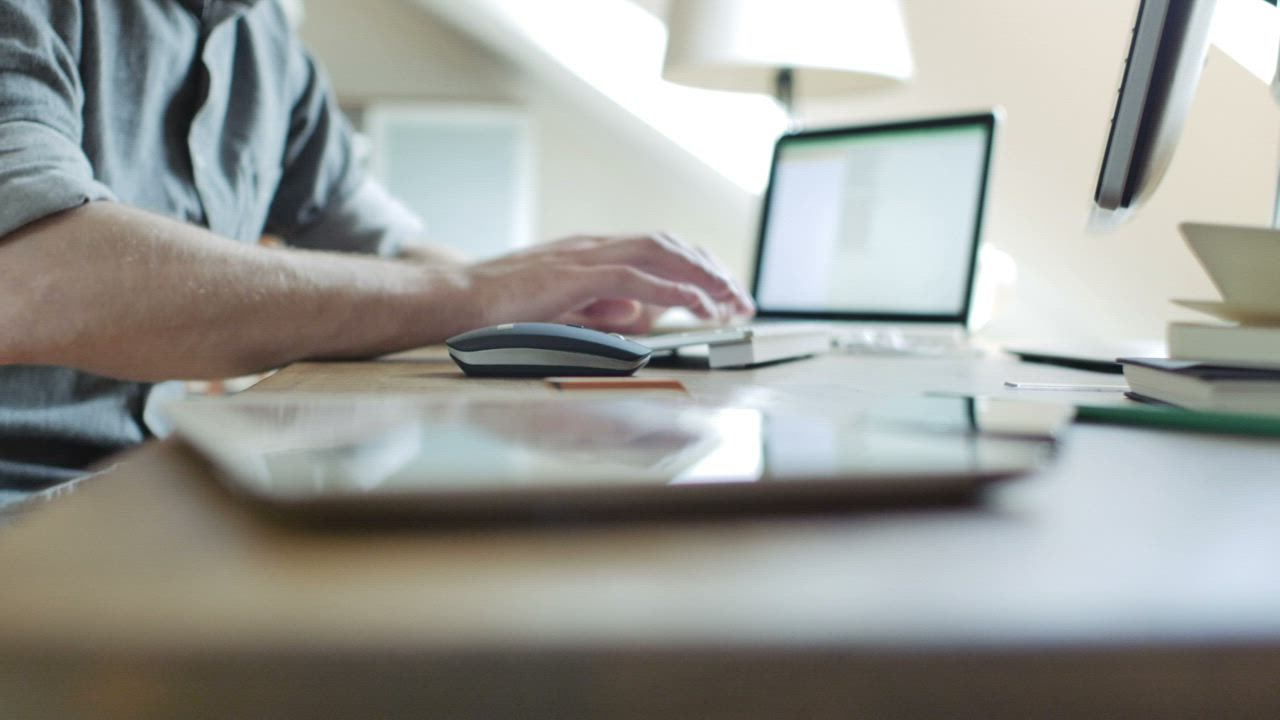 Man working on a Mac in a studio - Free Stock Video