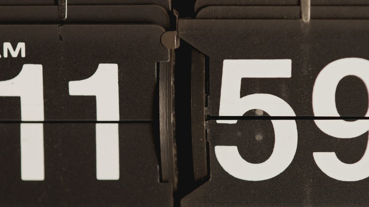 12:00 numbers on a flip clock - Free Stock Video
