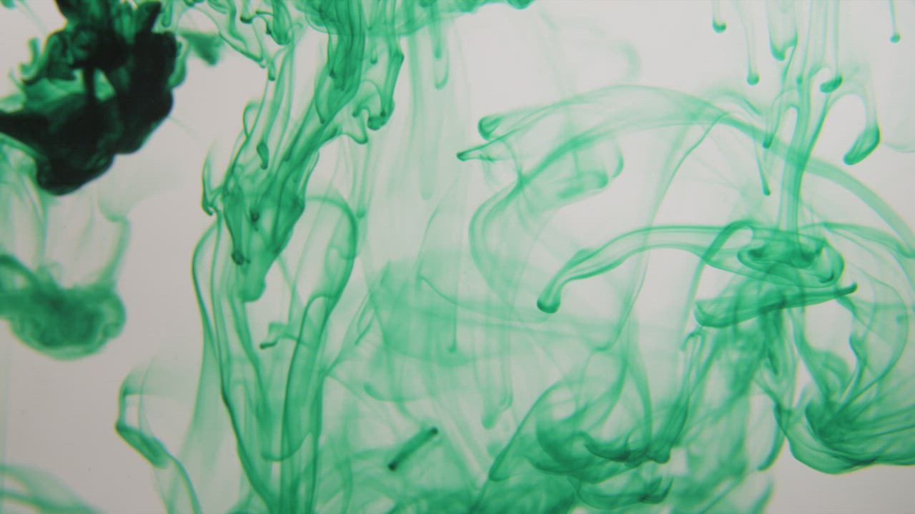 Green ink spreading through water - Free Stock Video