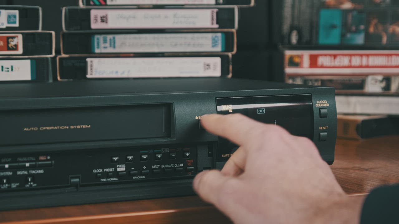 Man ejecting a VHS tape - Free Stock Video