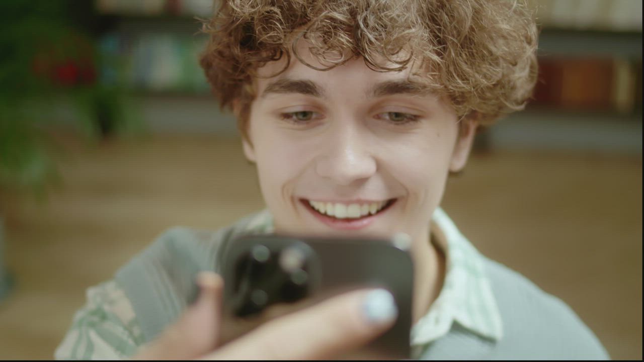 Close up of a young man greeting people on a video call - Free Stock Video