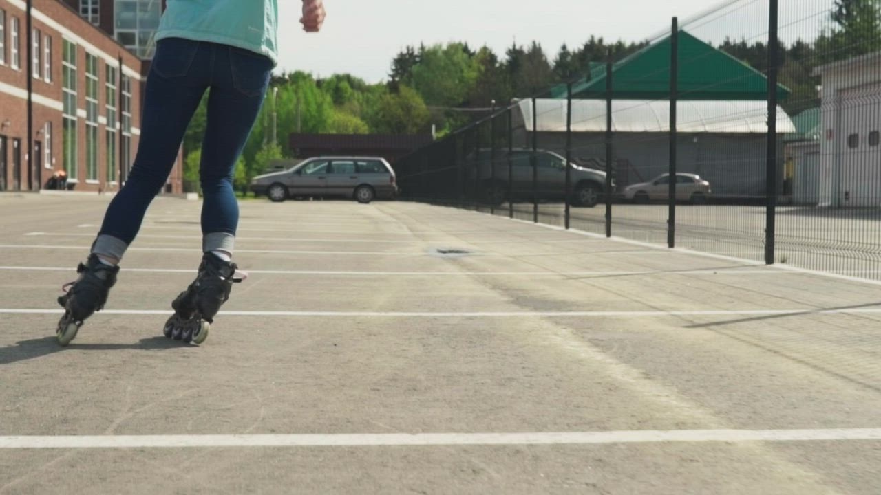 Woman twirling around on rollerblades - Free Stock Video