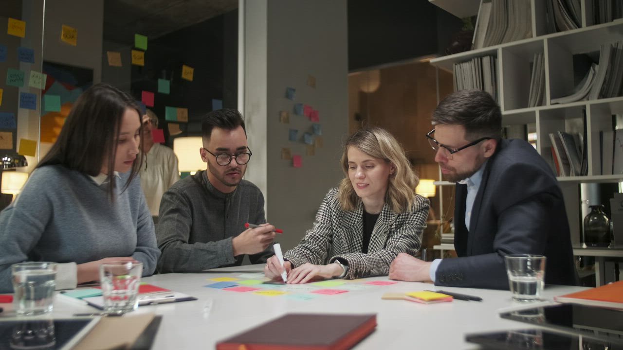Co-workers sharing ideas during a workshop - Free Stock Video