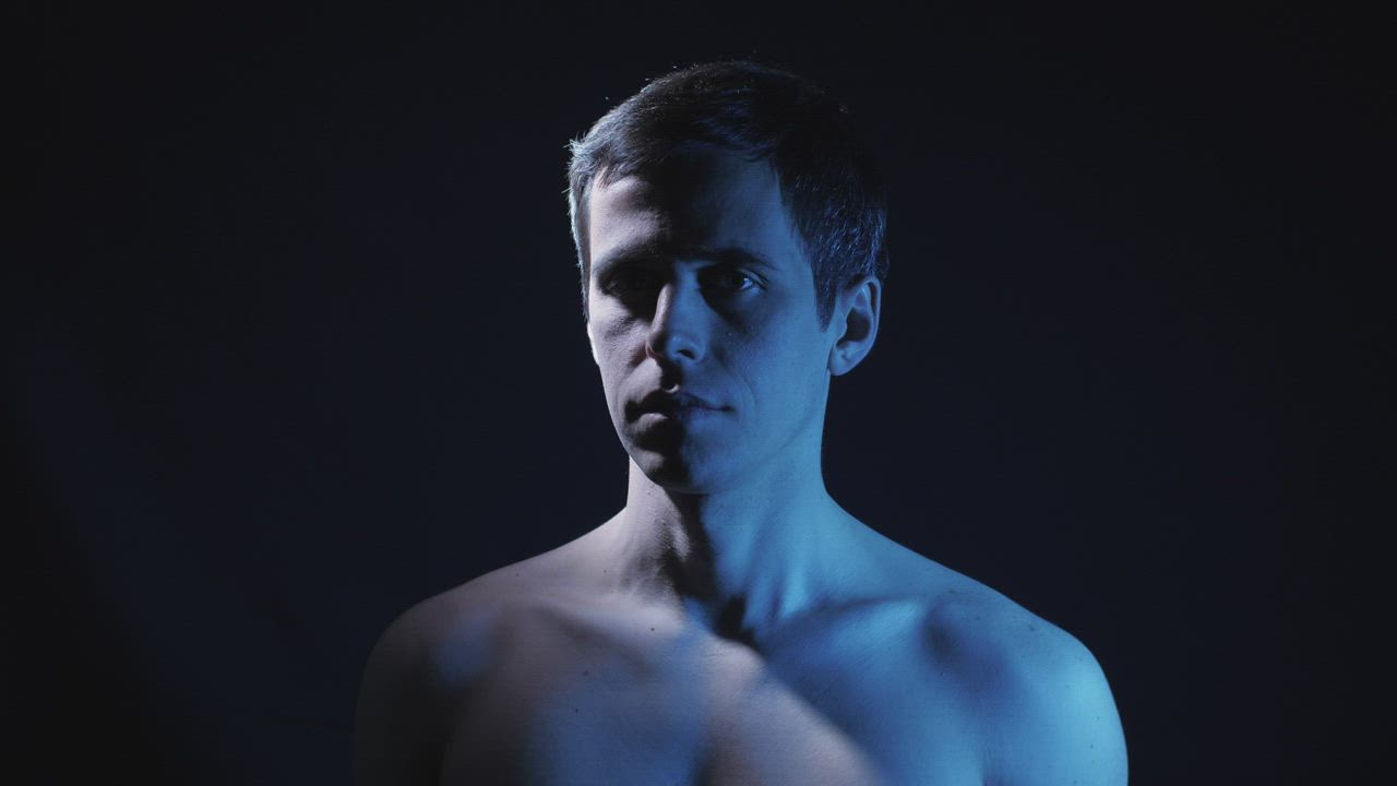 Man rotating against a dark background - Free Stock Video