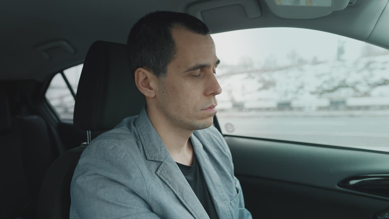 Drowsy man falling asleep at the wheel - Free Stock Video