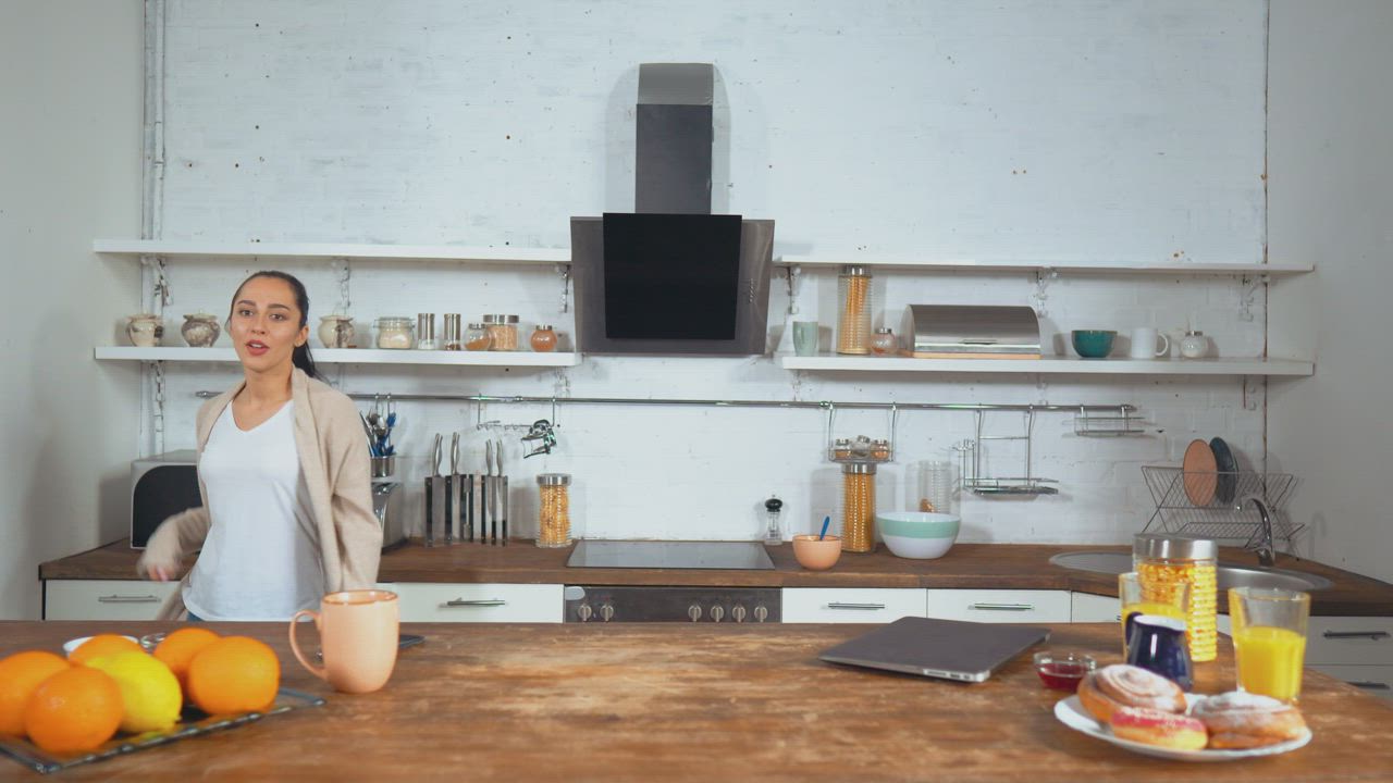 Young woman dancing happily in the kitchen - Free Stock Video