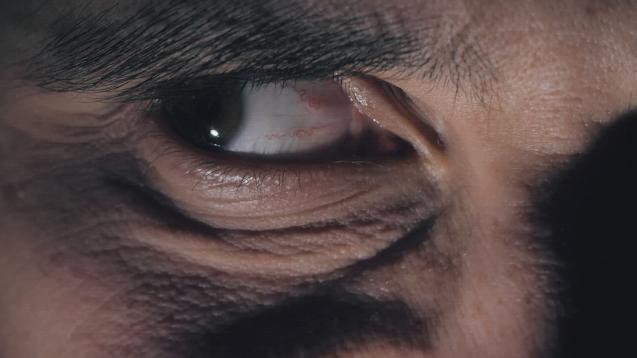 Close up of a man with scary darting eyes - Free Stock Video