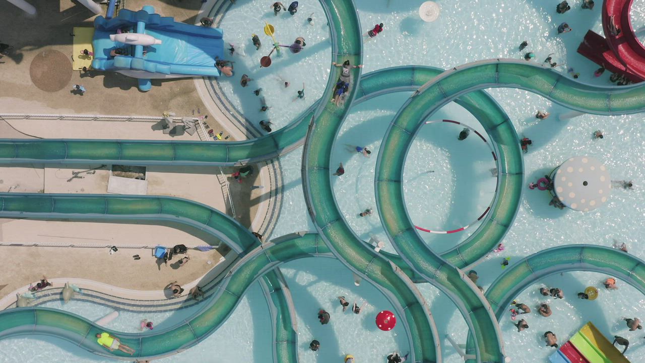 Aerial view of a busy water park - Free Stock Video
