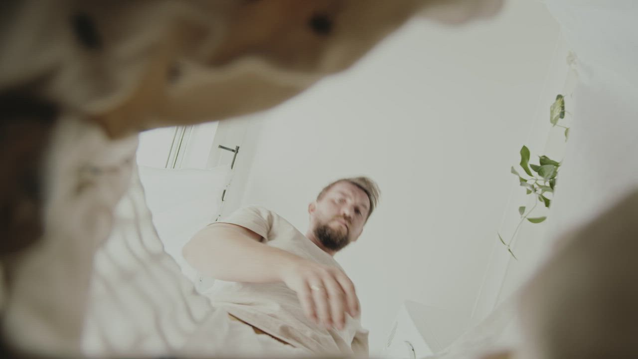 Man removing clothes from a washing basket - Free Stock Video
