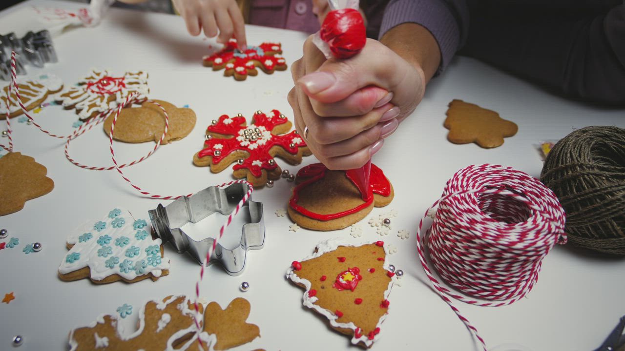 Close up of people decorating gingerbread cookies for Christmas - Free ...