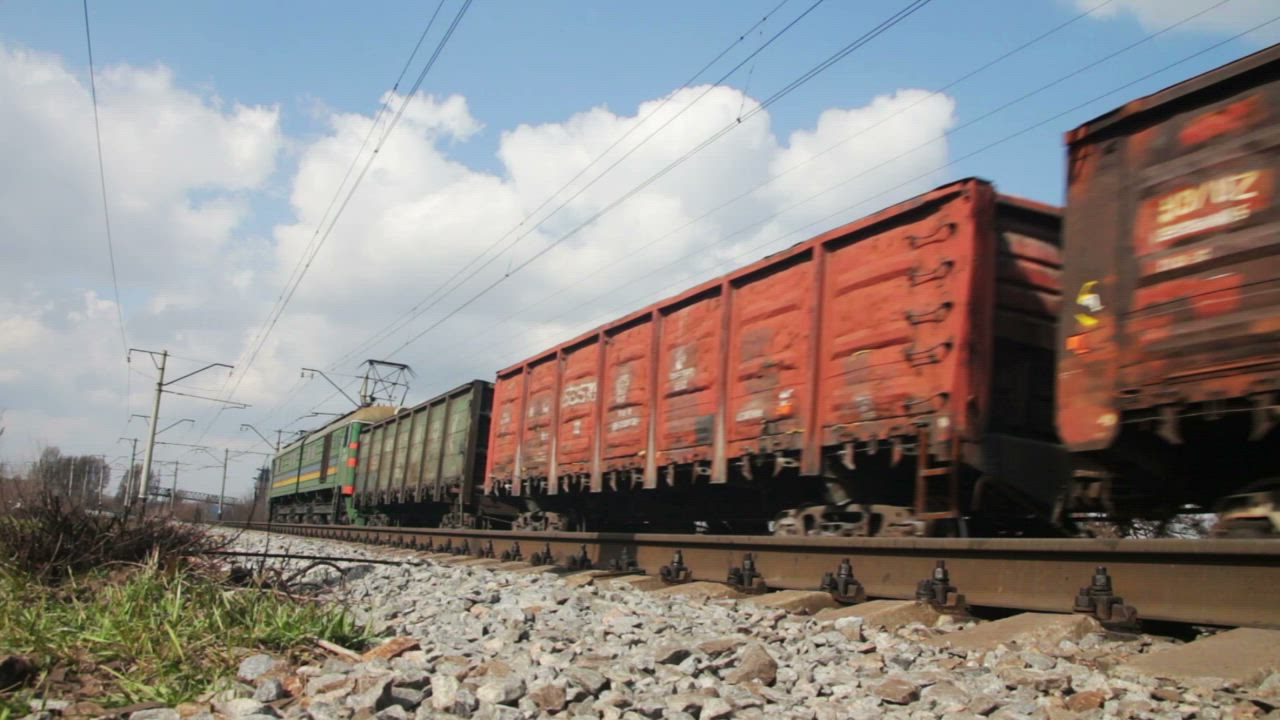 Freight train rides on rails - Free Stock Video