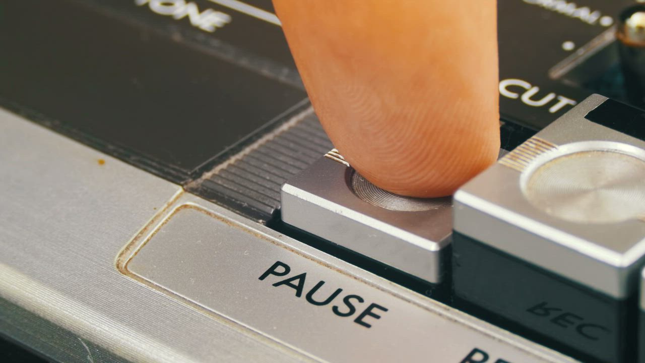 Man pushing pause button - Free Stock Video