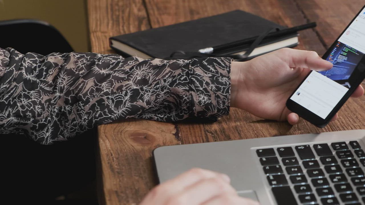 Person working while scrolling on social networks - Free Stock Video