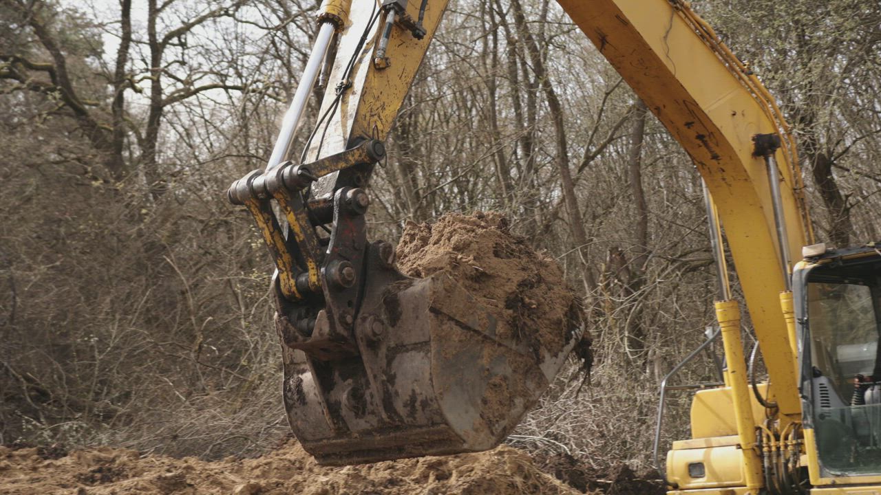 Loader digging earth for construction - Free Stock Video