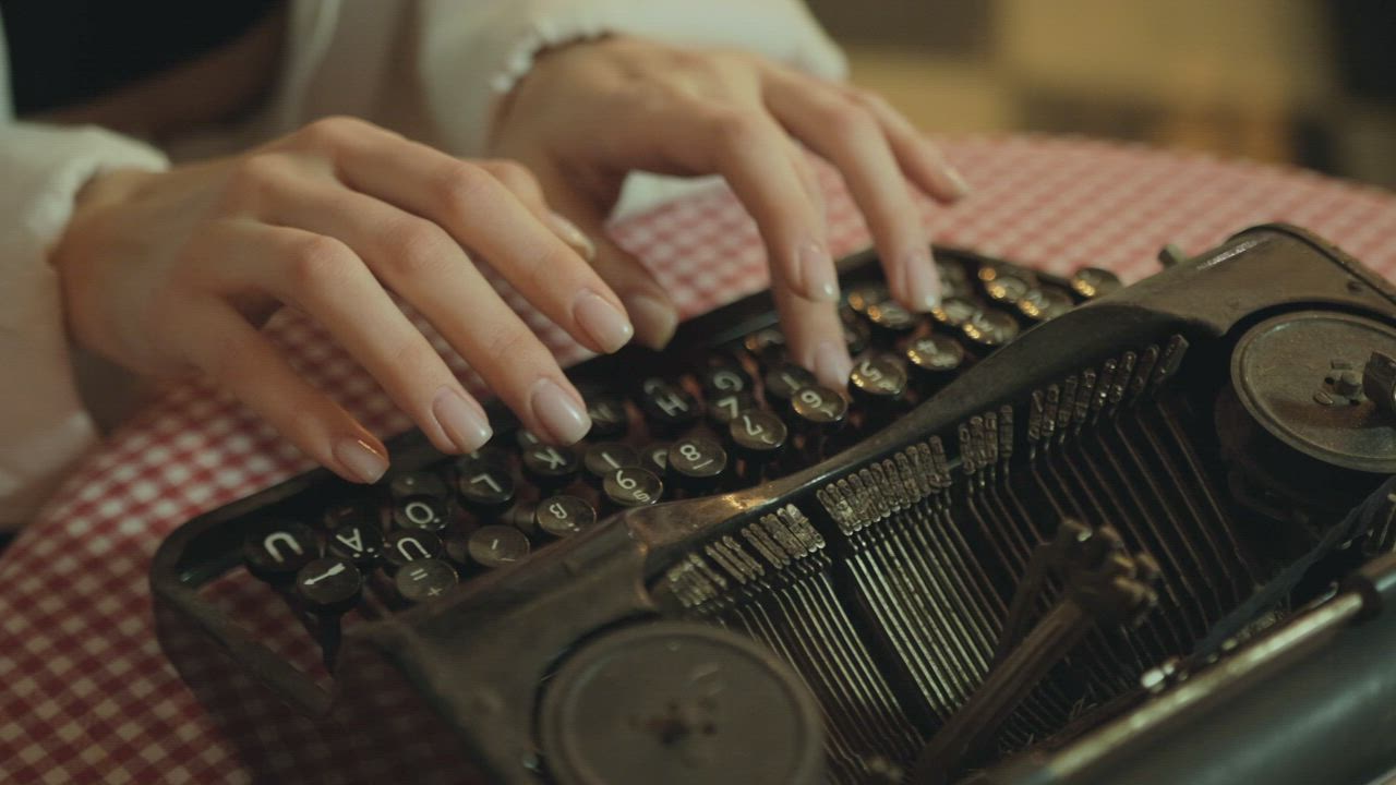 Girl using old typewriter - Free Stock Video