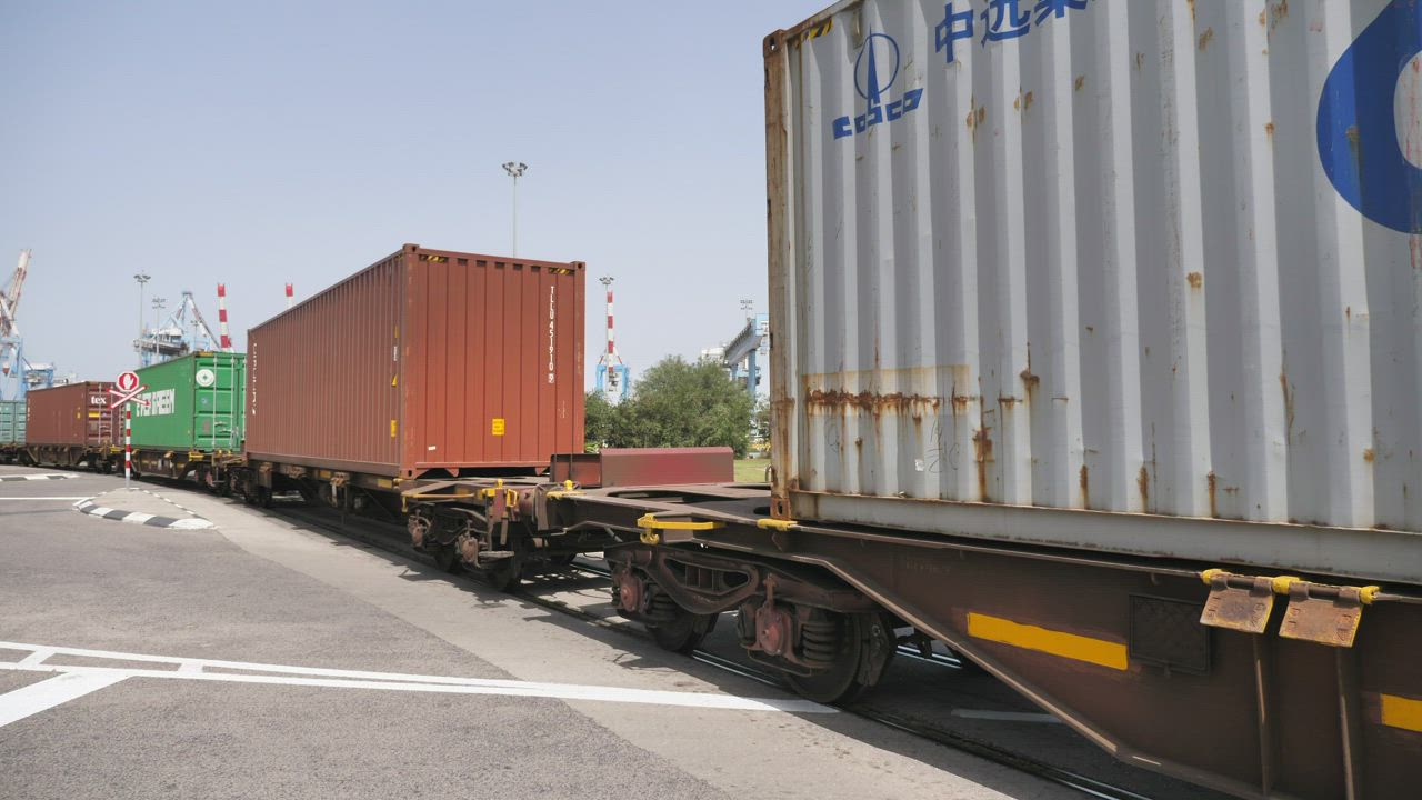 Close up of a freight training moving along the tracks - Free Stock Video