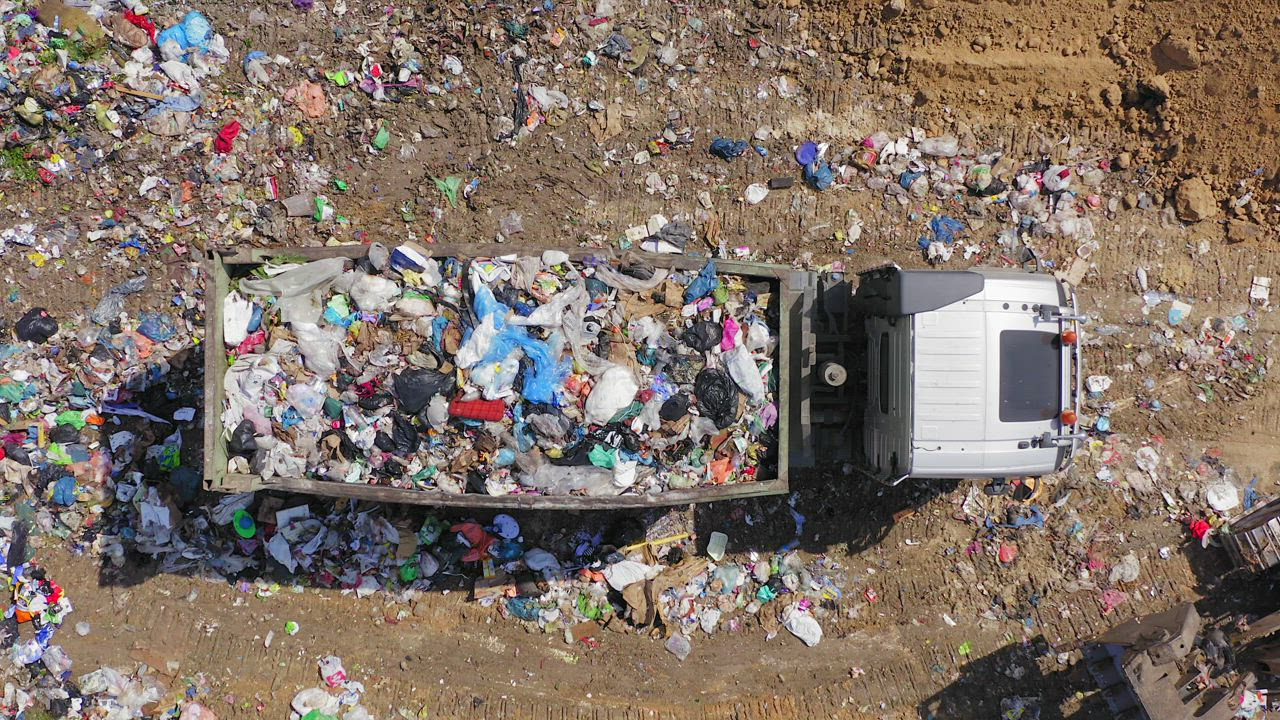 Large pile of rubbish being dumped at landfill - Free Stock Video