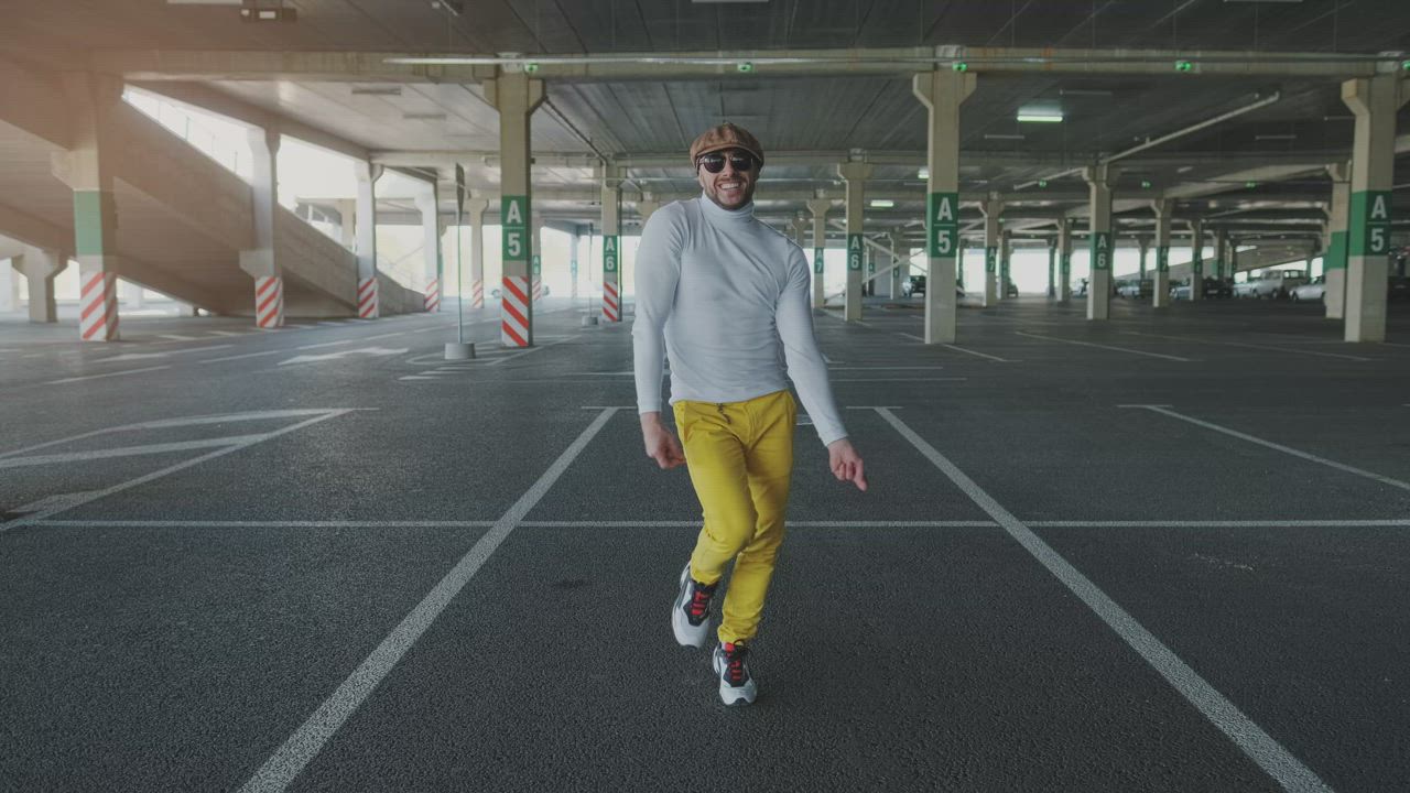 Cheerful man dancing an individual choreograph - Free Stock Video