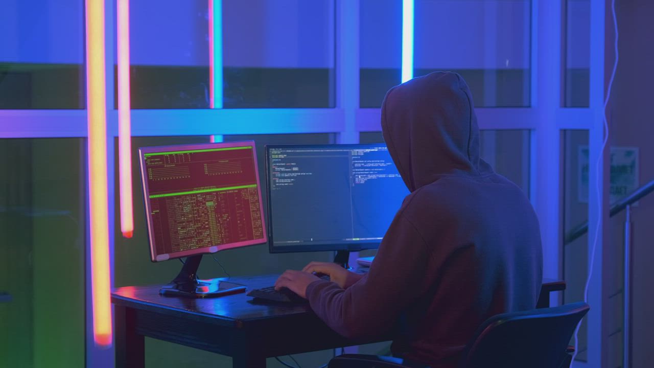 Hacker Writing Code On A Computer Screen Free Stock Video