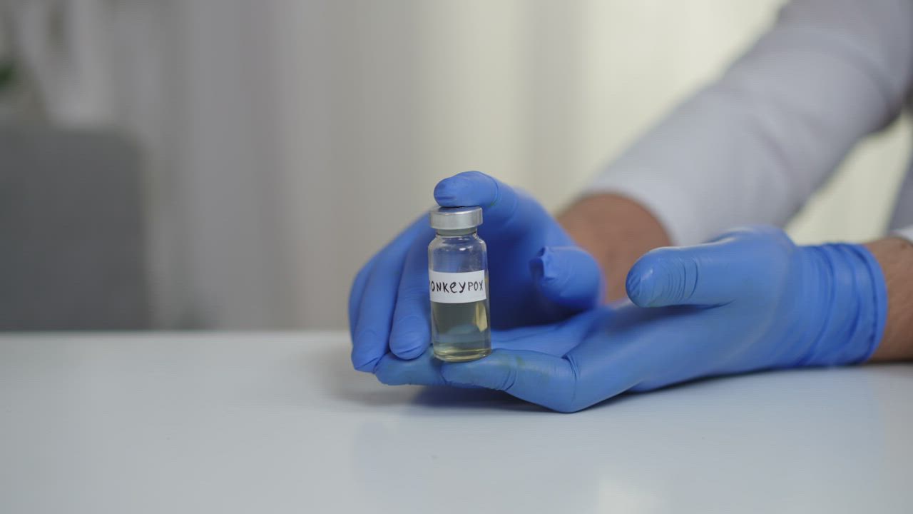 Close up of a vile of vaccine being held by a doctor - Free Stock Video