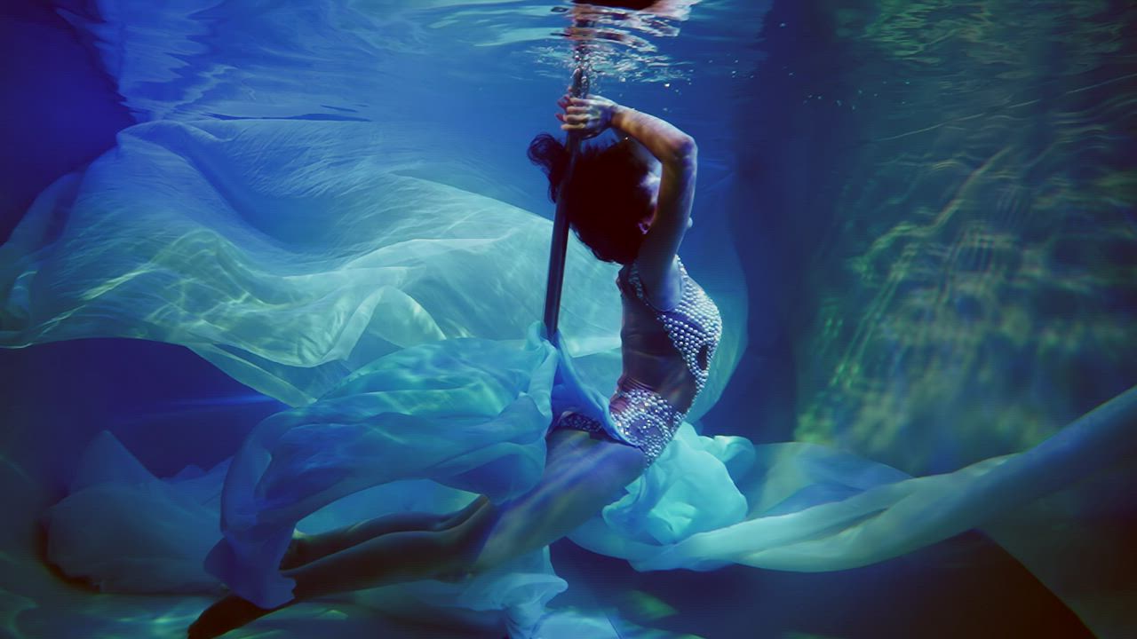 Pole dancer inside the water - Free Stock Video