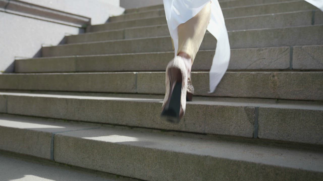 Close up of a woman wearing high heels running up the stairs - Free ...