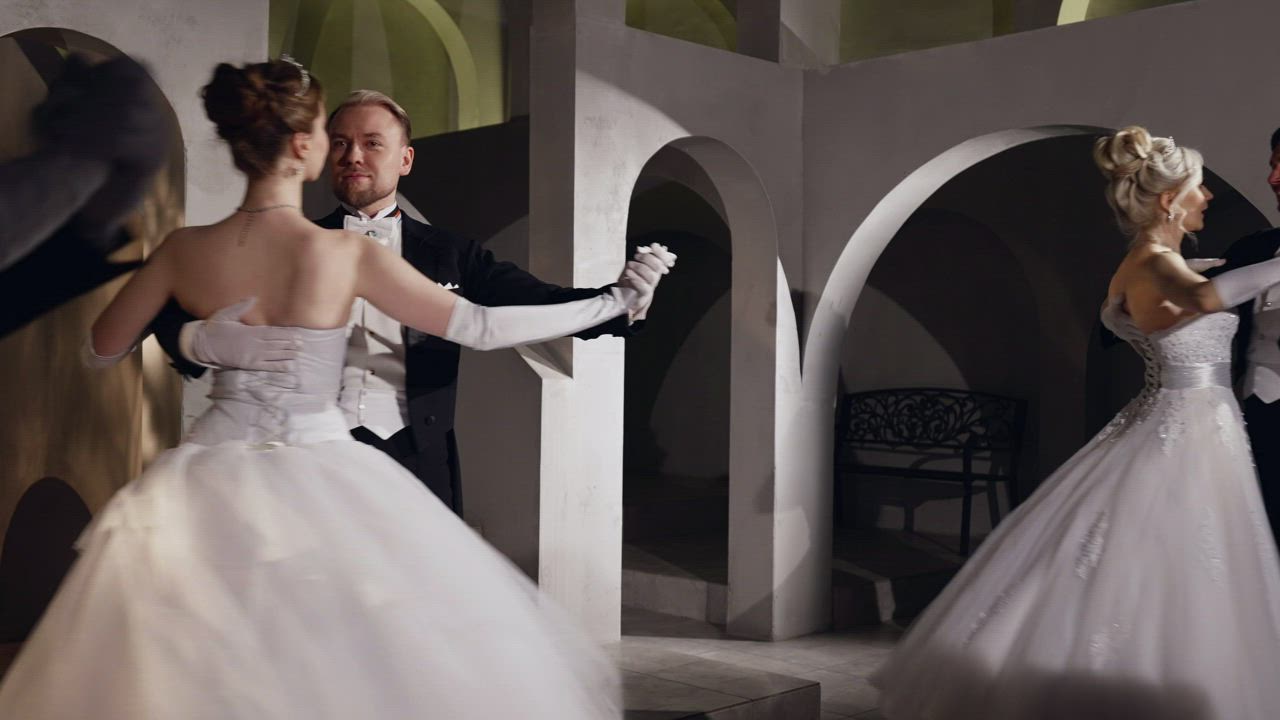 Couples doing the Waltz across a ballroom - Free Stock Video