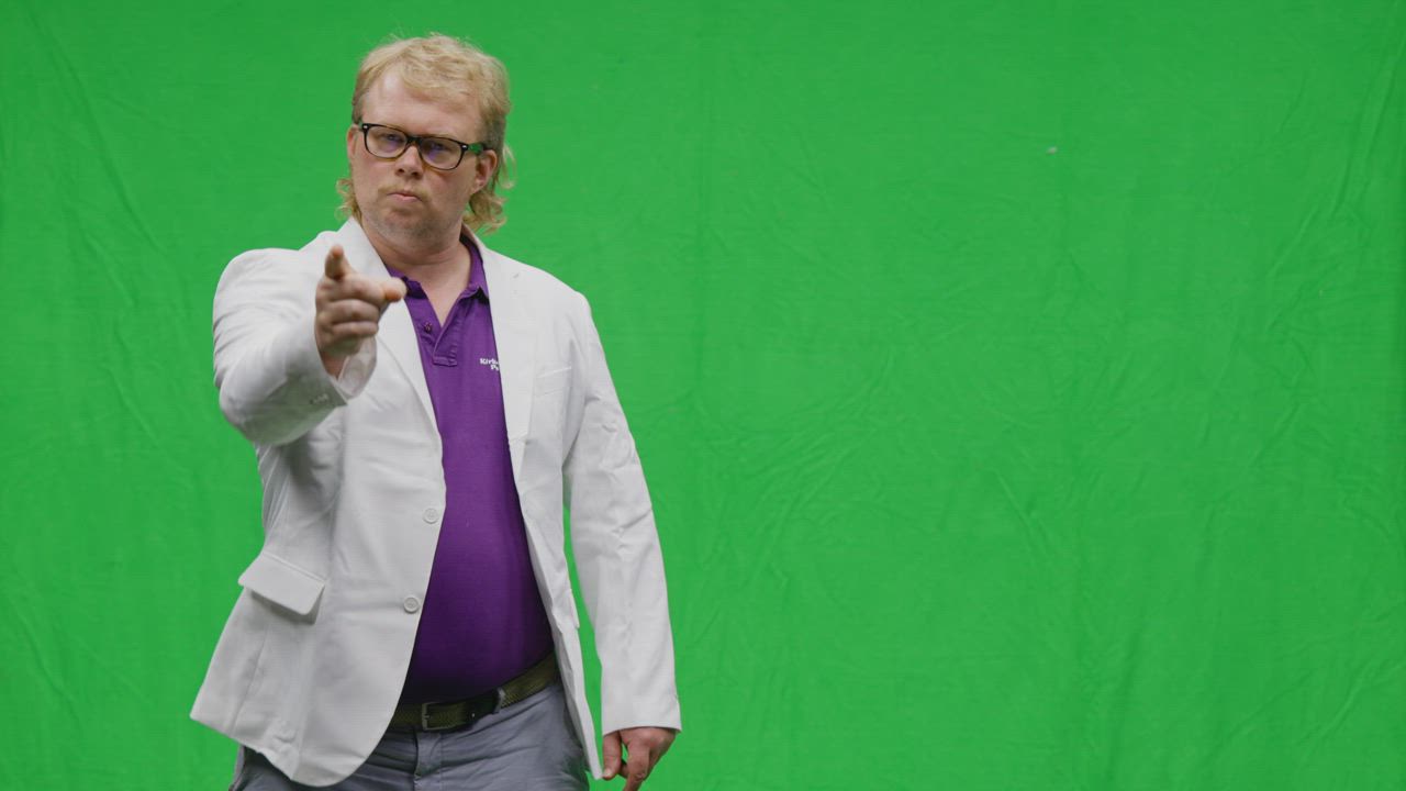 Man pointing to camera on green screen background - Free Stock Video