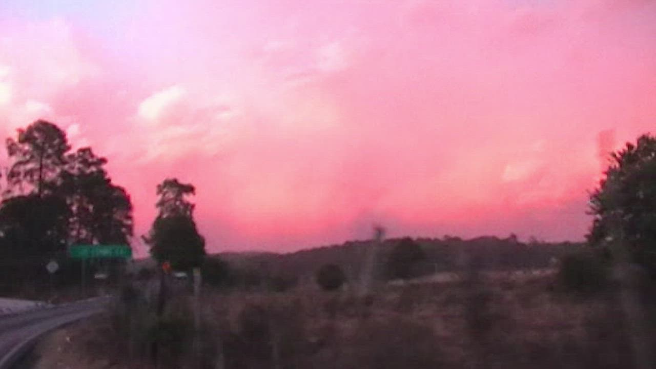 Pink sunset sky from a moving car - Free Stock Video
