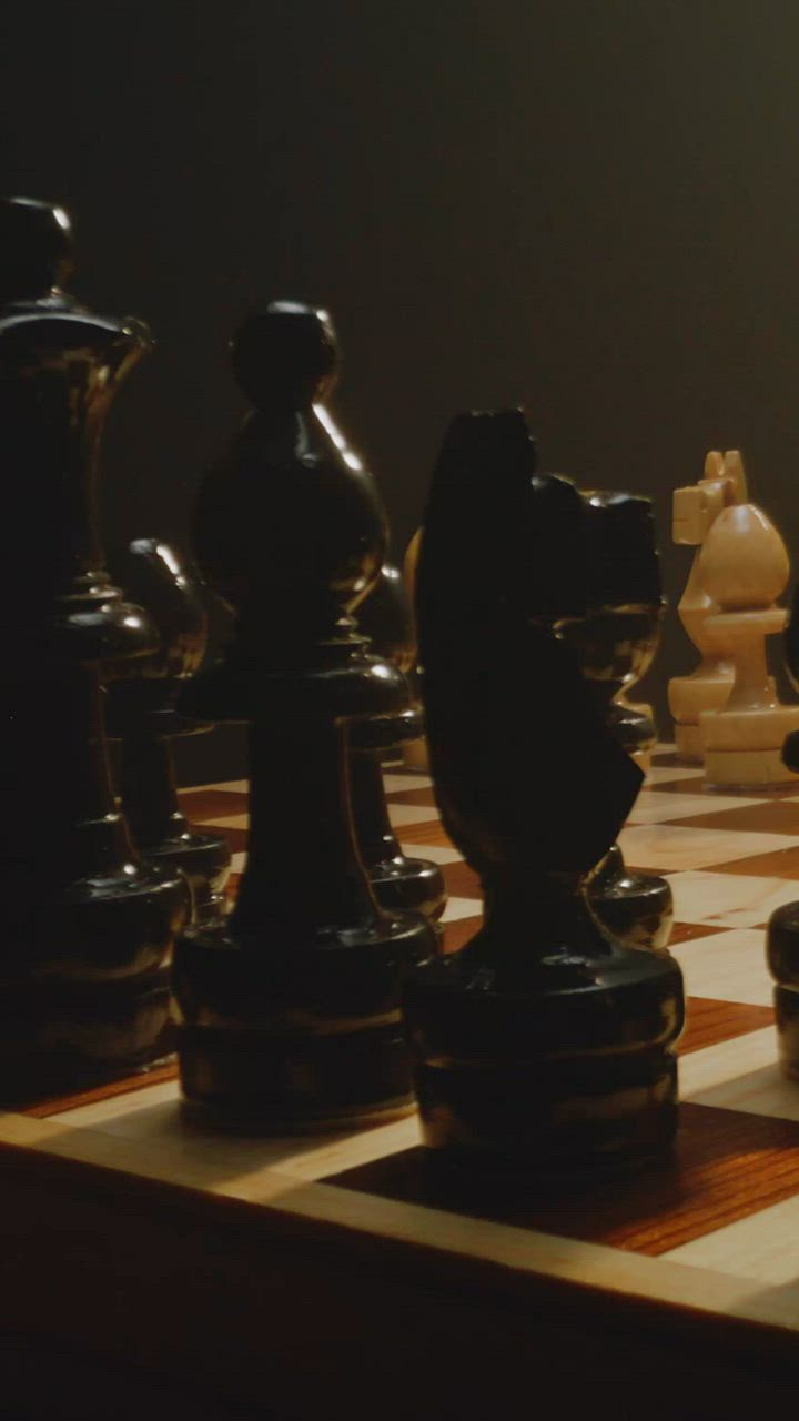 Wooden chess board with an overhead light - Free Stock Video