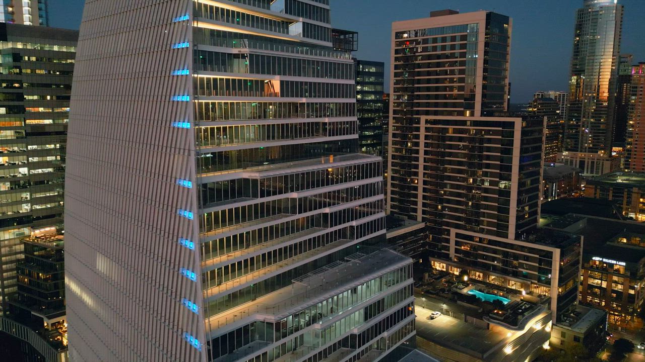 Aerial view to modern glass buildings of a big city at night - Free ...